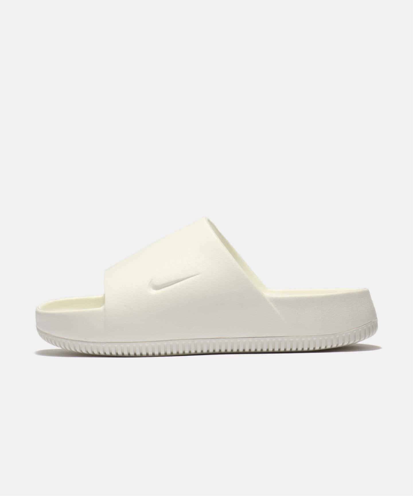 NIKE W CALM SLIDE DX4816-100 – Herringbone Footwear｜ヘリンボーンフットウェア